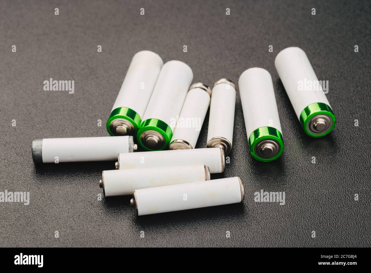 close up of battery positive poles on black backgrounds. intended ...