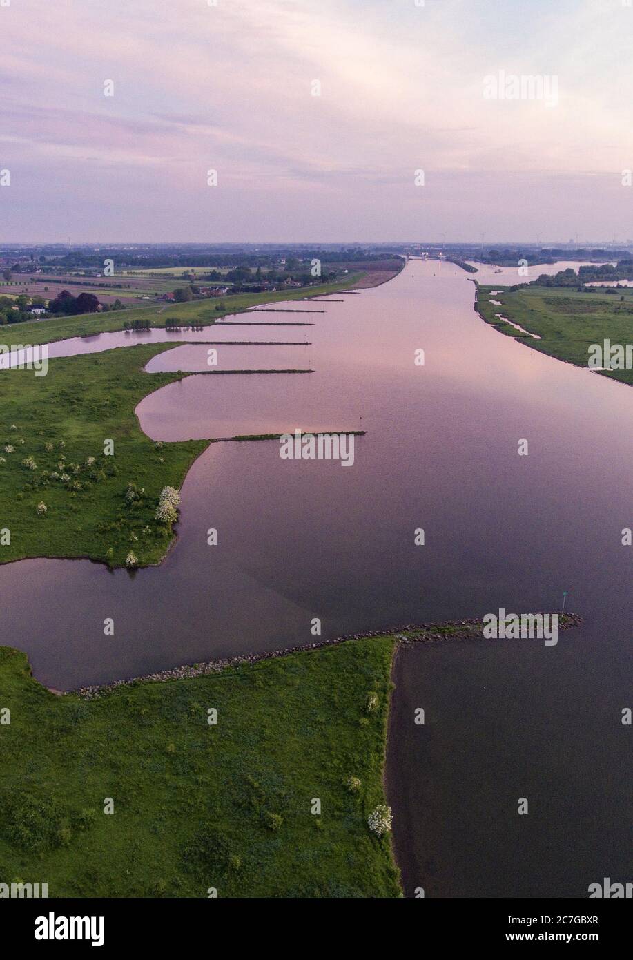 Vertical shot of Dutch polder landscape with the river Lek Stock Photo ...