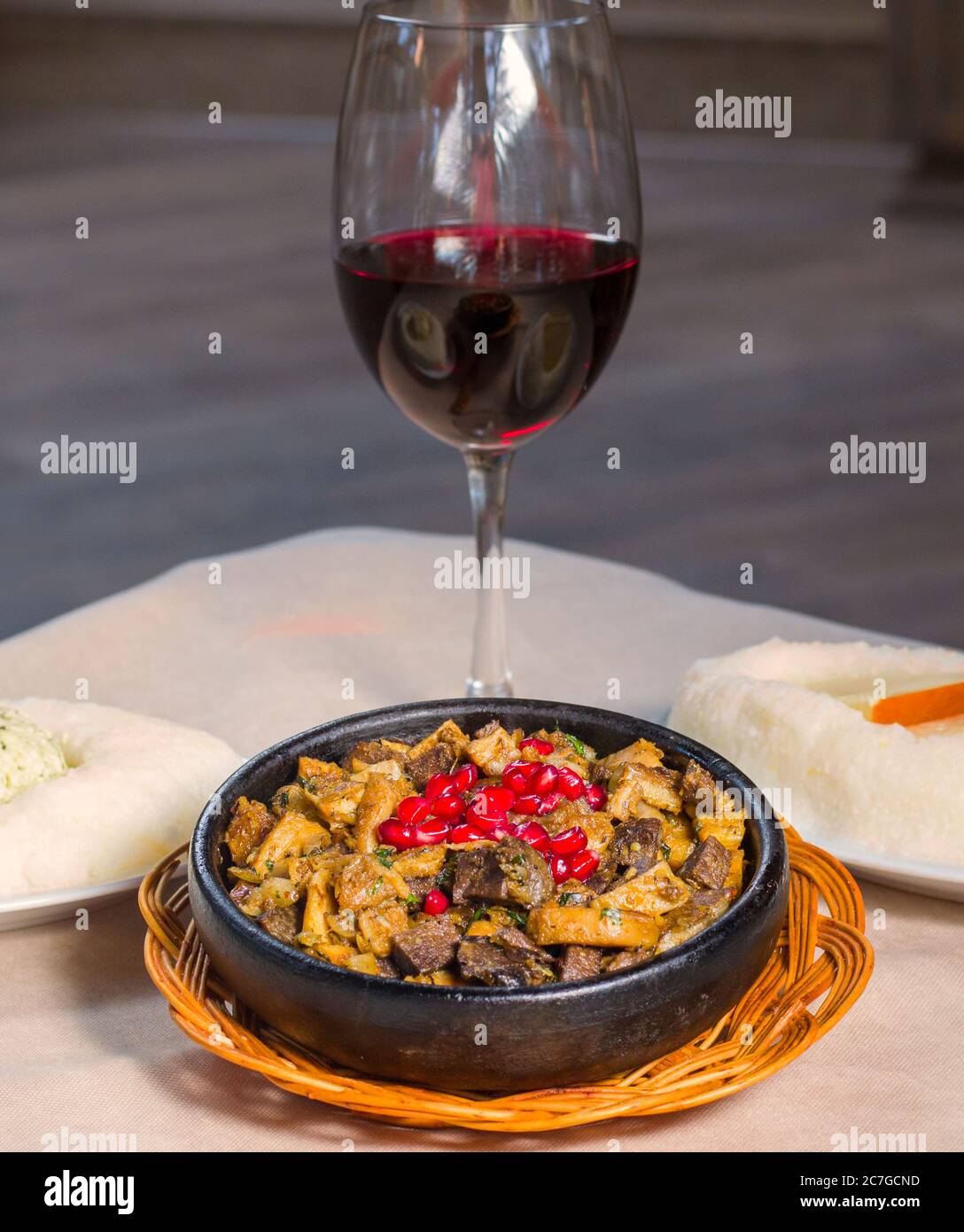 Kuchmachi, Georgian traditional food with meat, walnuts, pomegranates ...