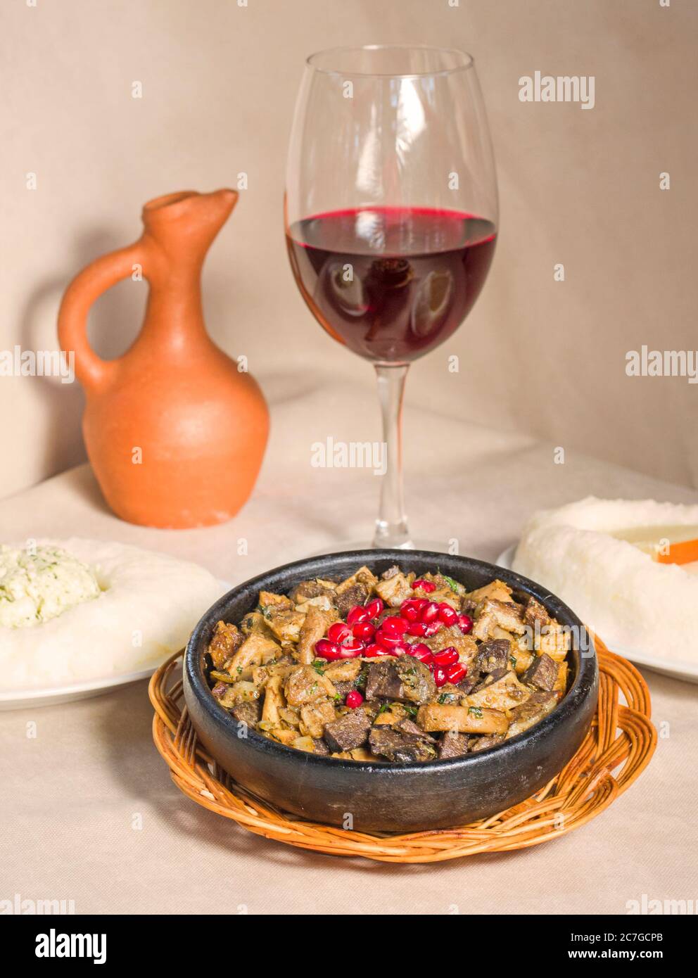 Kuchmachi, Georgian traditional food with meat, walnuts, pomegranates ...