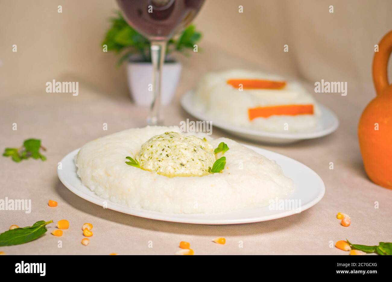 Georgian traditional food and cuisine ghomi with cheese and red wine ...