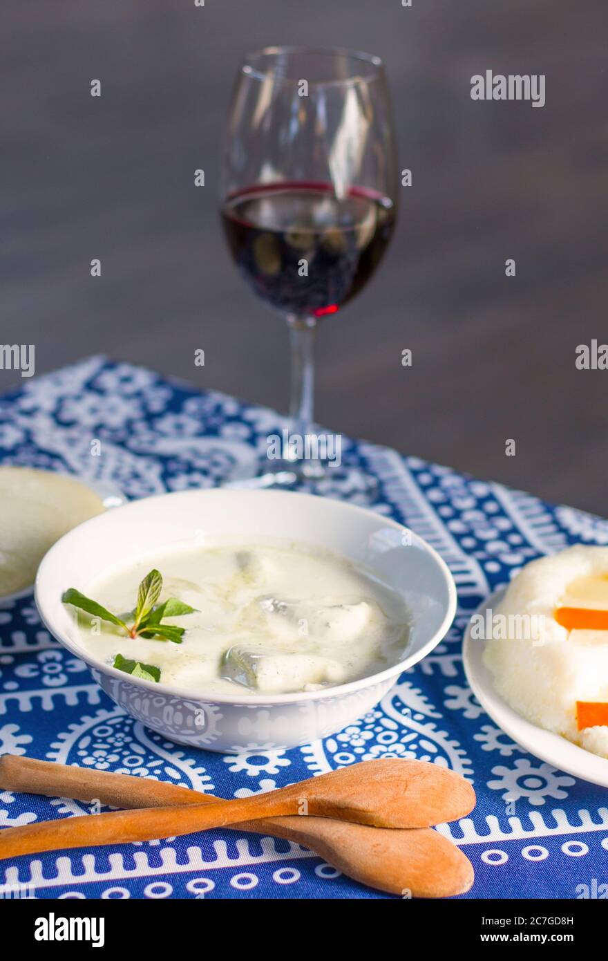 Georgian traditional food Gebjalia, cheese in milk and greens, species ...