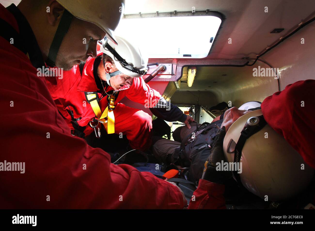Firefighters practicing rescuing a person, after a fictitious accident ...
