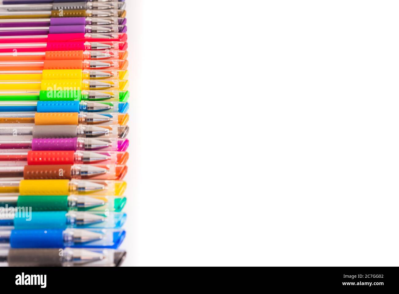 Group of colorful school pens isolated on white studio background for ...