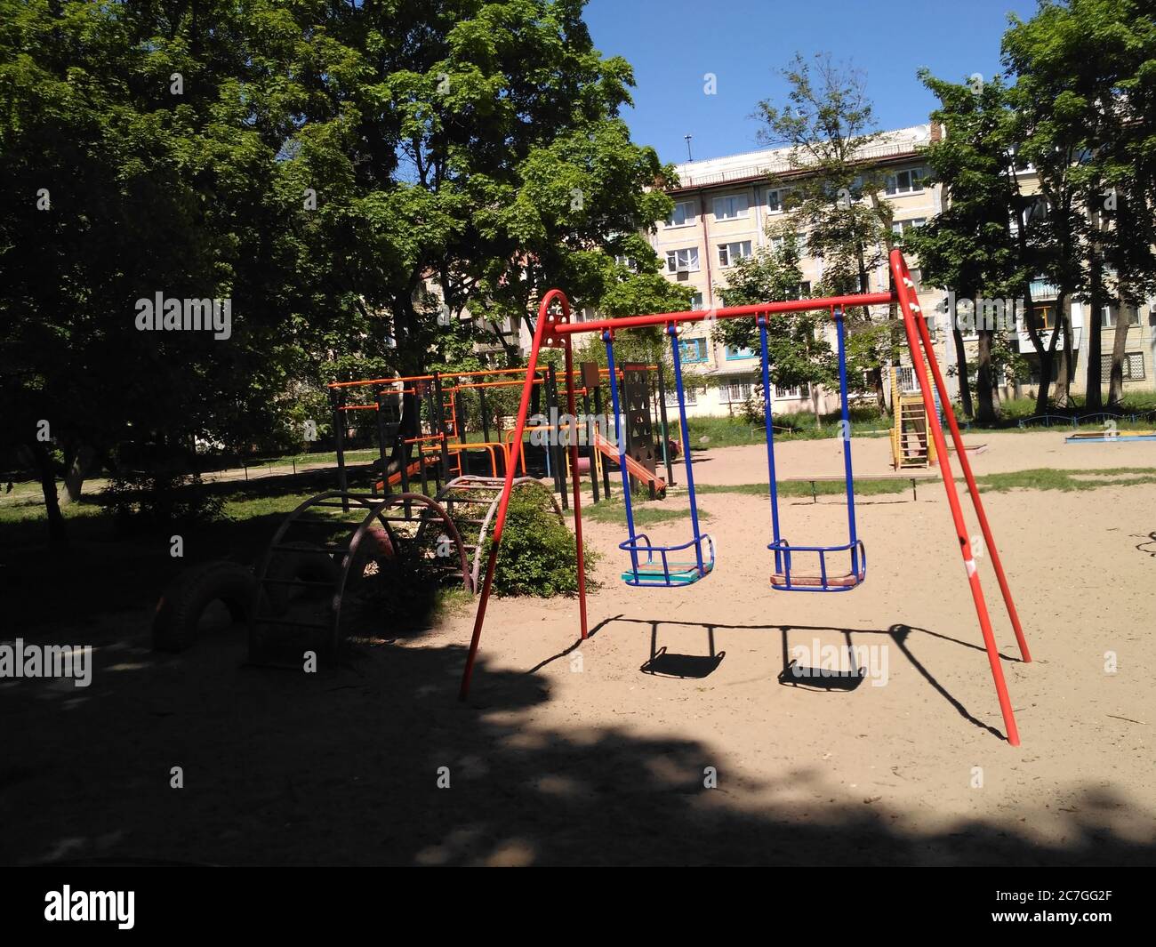 Children playing on swings and slides hi-res stock photography and ...