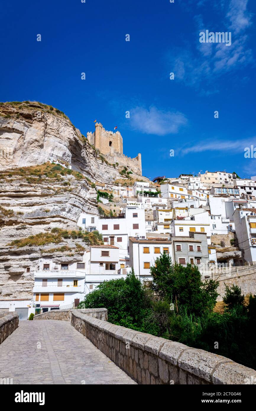 View of the tourist Spanish city of Alcala del Jucar, with its castle ...