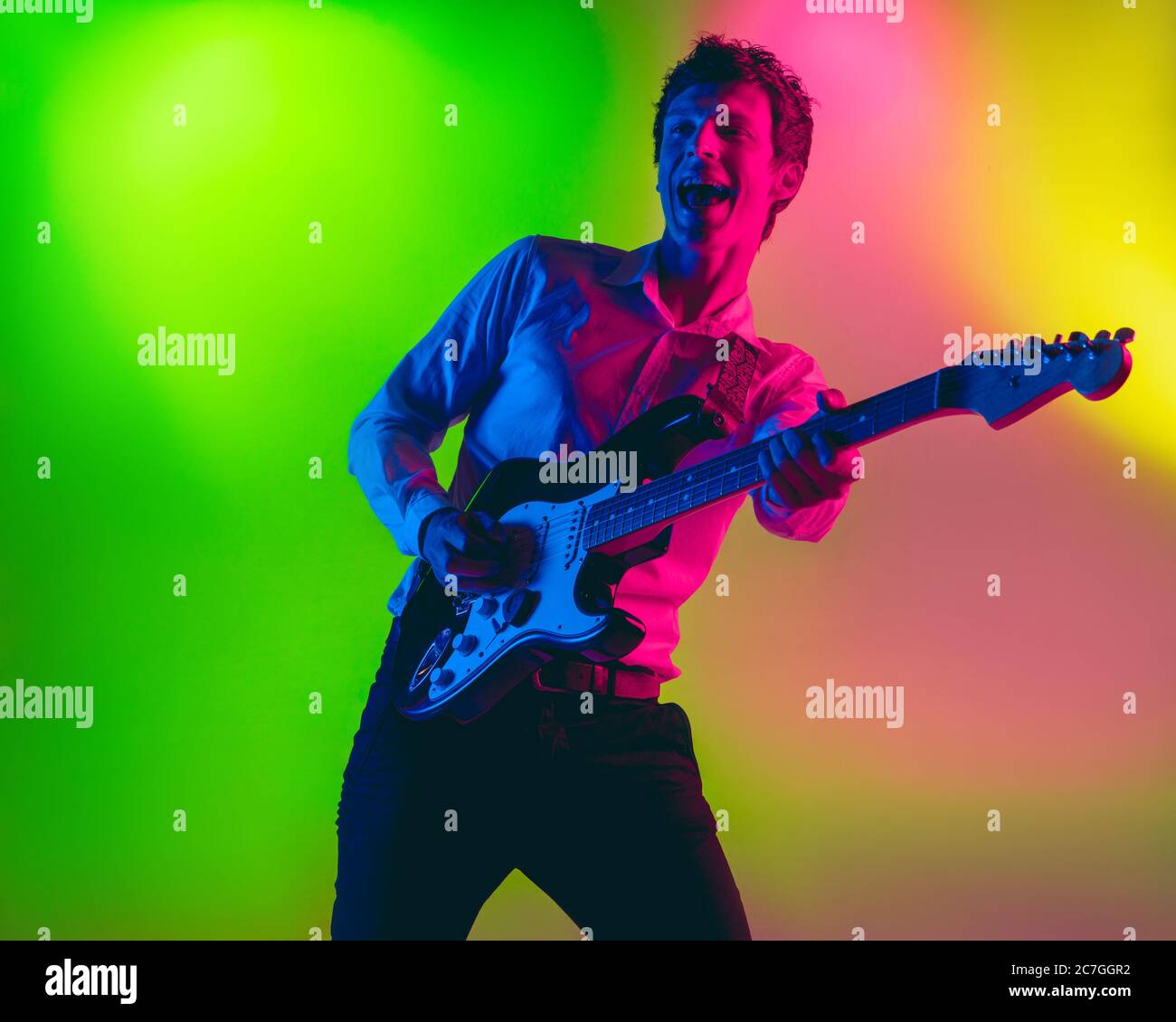 Talented. Young caucasian inspired and expressive musician, guitarist ...