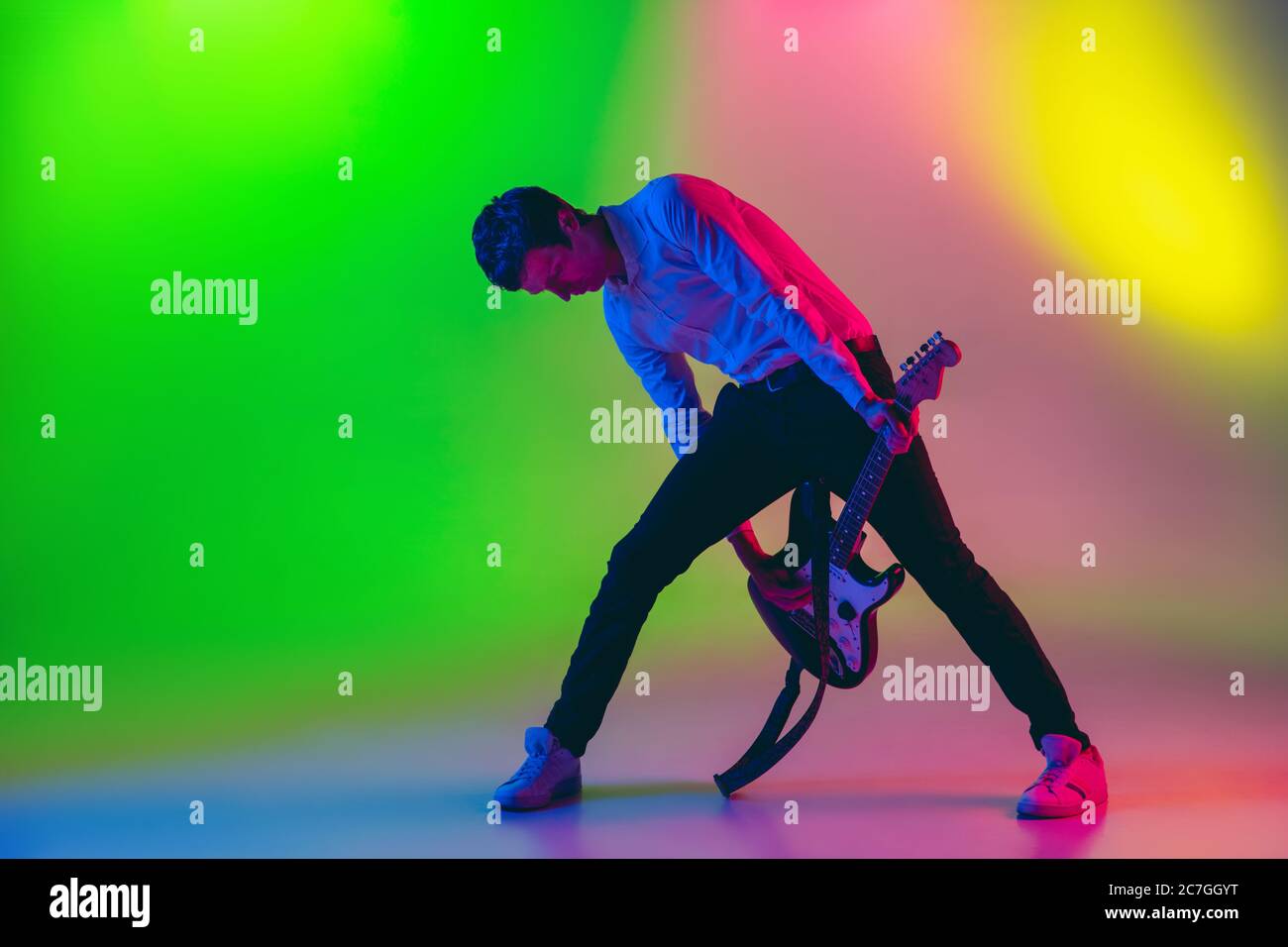 Talented. Young caucasian inspired and expressive musician, guitarist ...