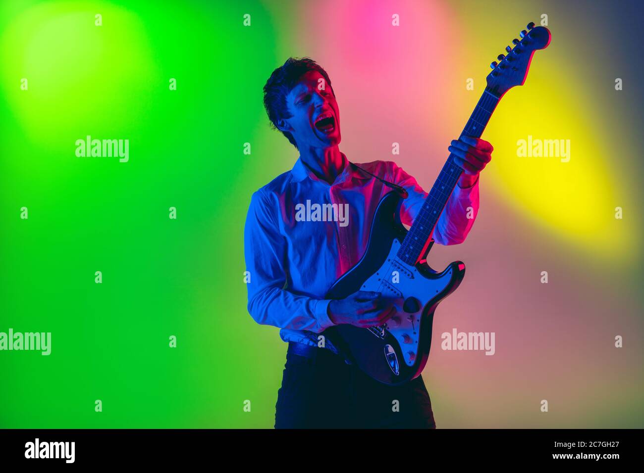 Talented. Young caucasian inspired and expressive musician, guitarist ...
