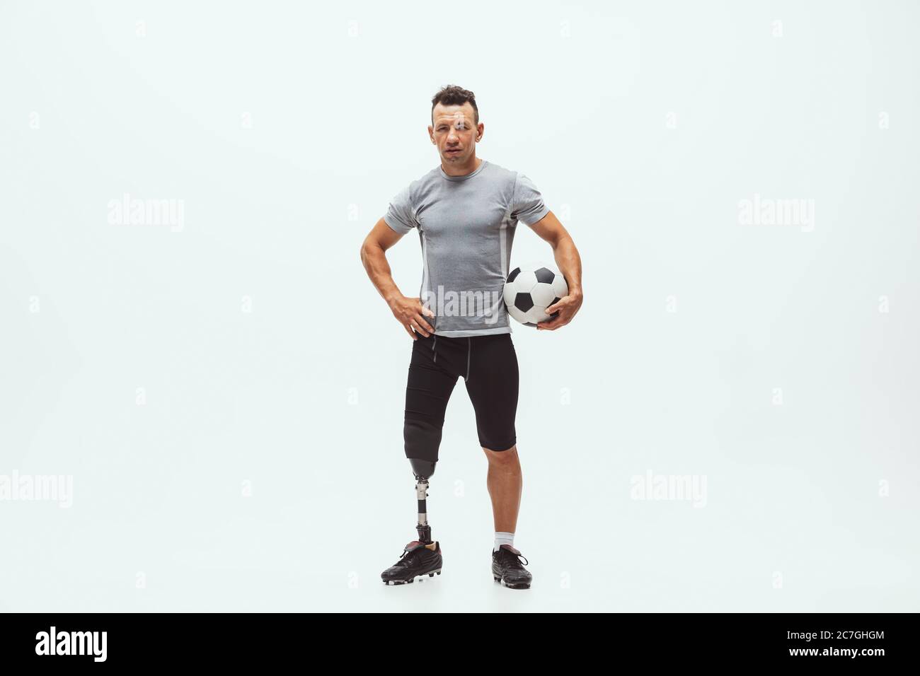 Athlete with disabilities or amputee on white studio background ...