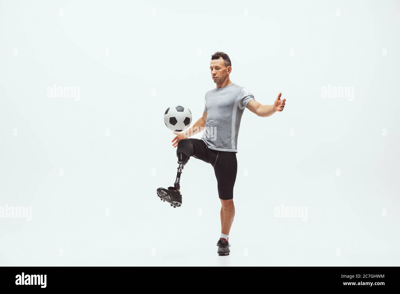 Athlete with disabilities or amputee on white studio background ...