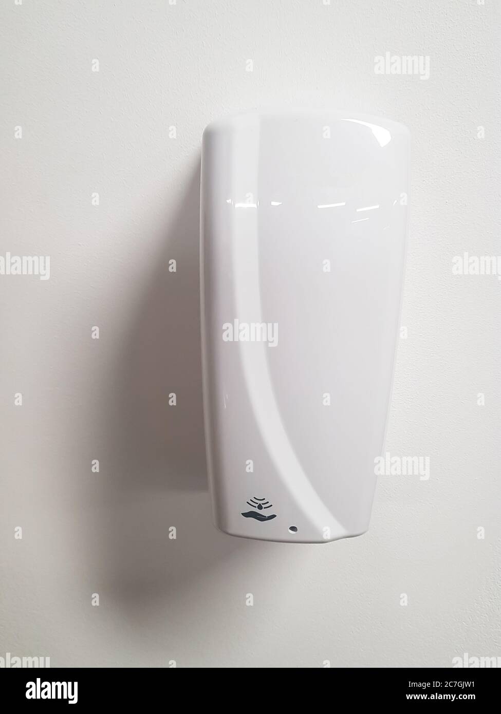 Wall automatic disinfectant dispenser indoors Stock Photo - Alamy
