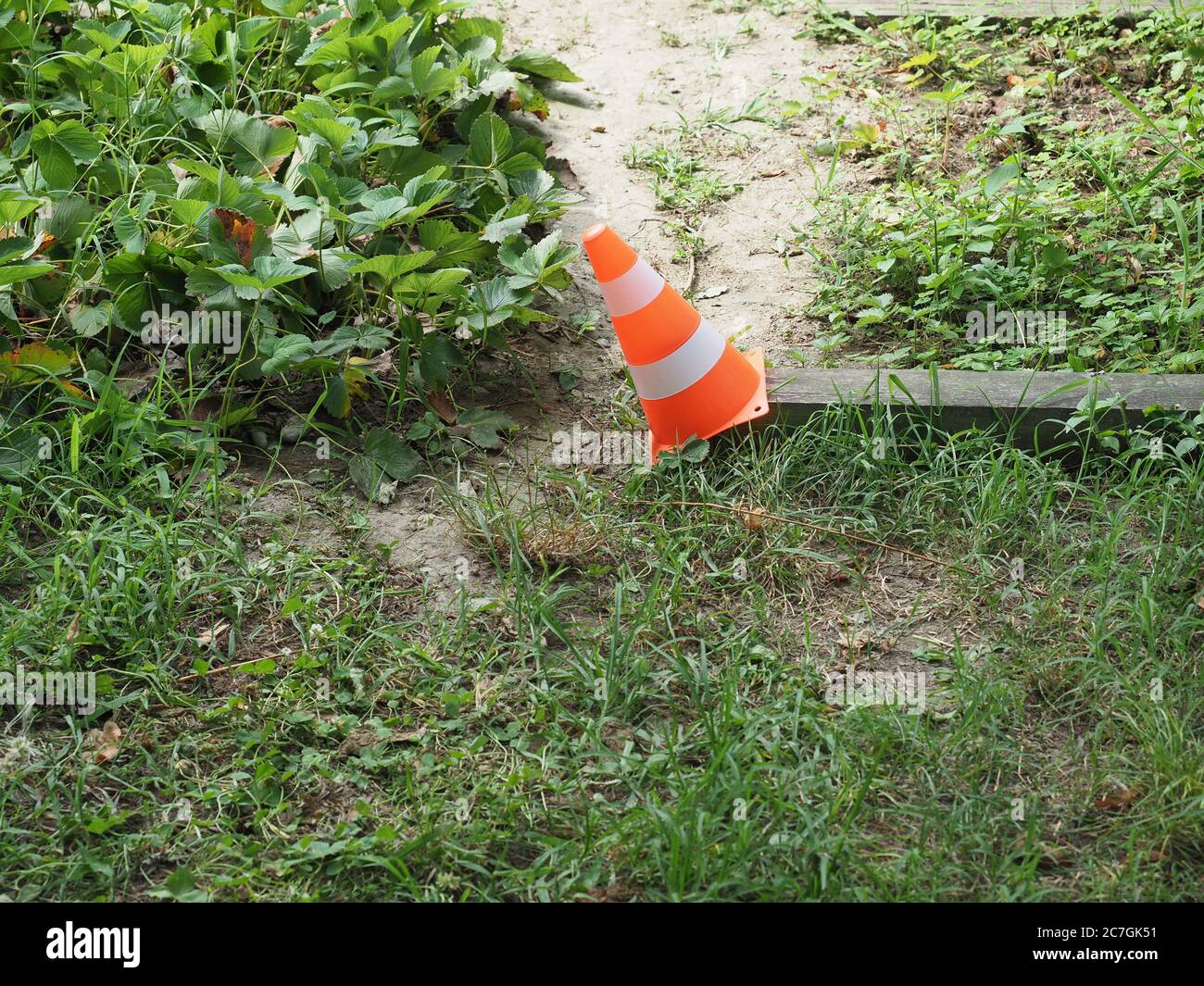 white and orange traffic cone to mark road works Stock Photo - Alamy