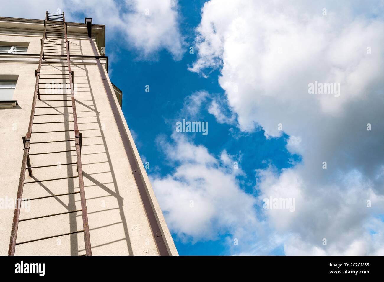 Fire escape, fire ladder on the wall of the building. The concept of ...
