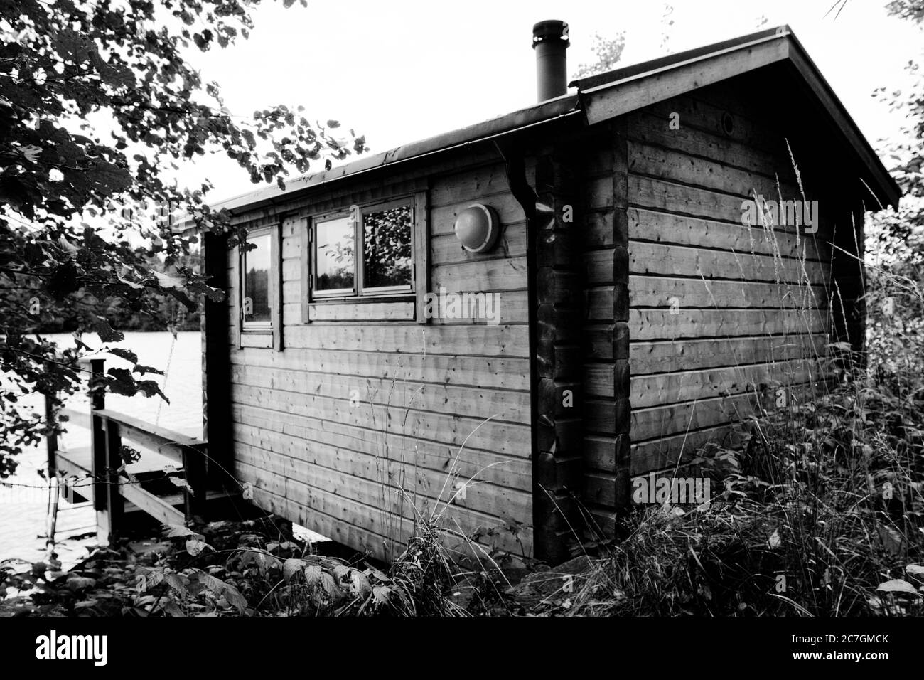 Cottage surrounded by trees Black and White Stock Photos & Images - Alamy
