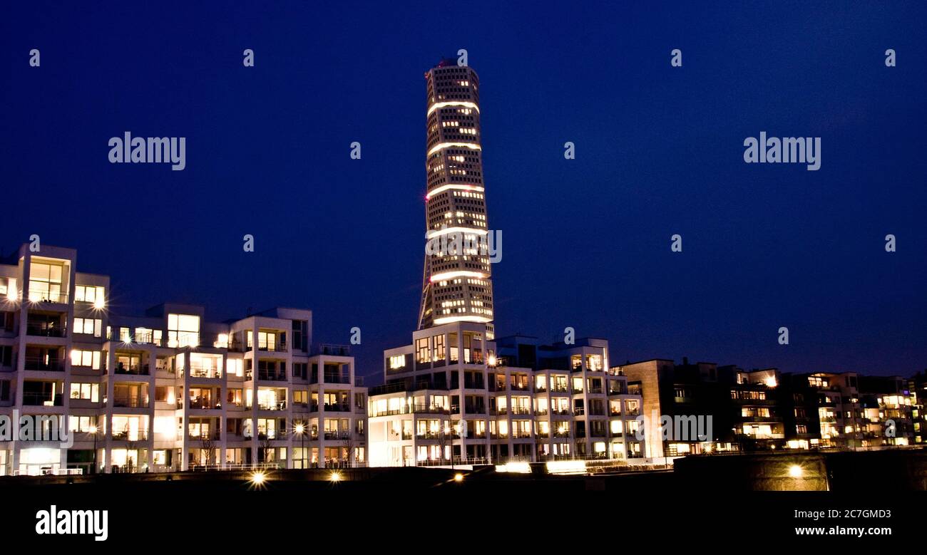 Beautiful shot of city buildings and a skyscraper with lit lights at ...