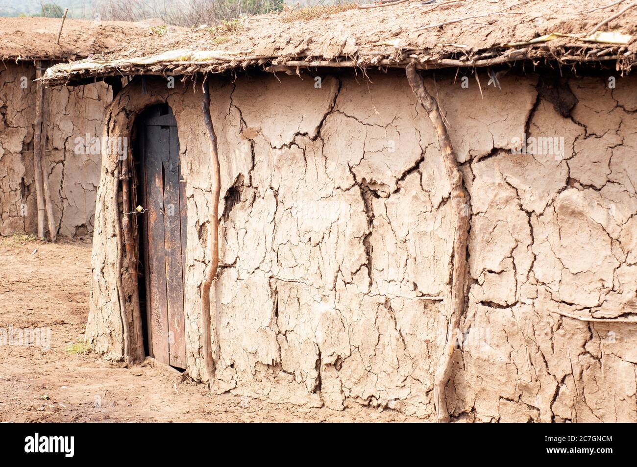 Traditional hut of clay in a maasai village. Maasai Mara National ...