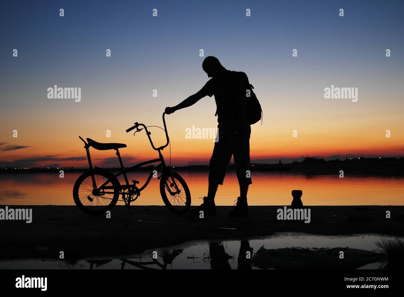 human silhouette in sunset sky Stock Photo - Alamy