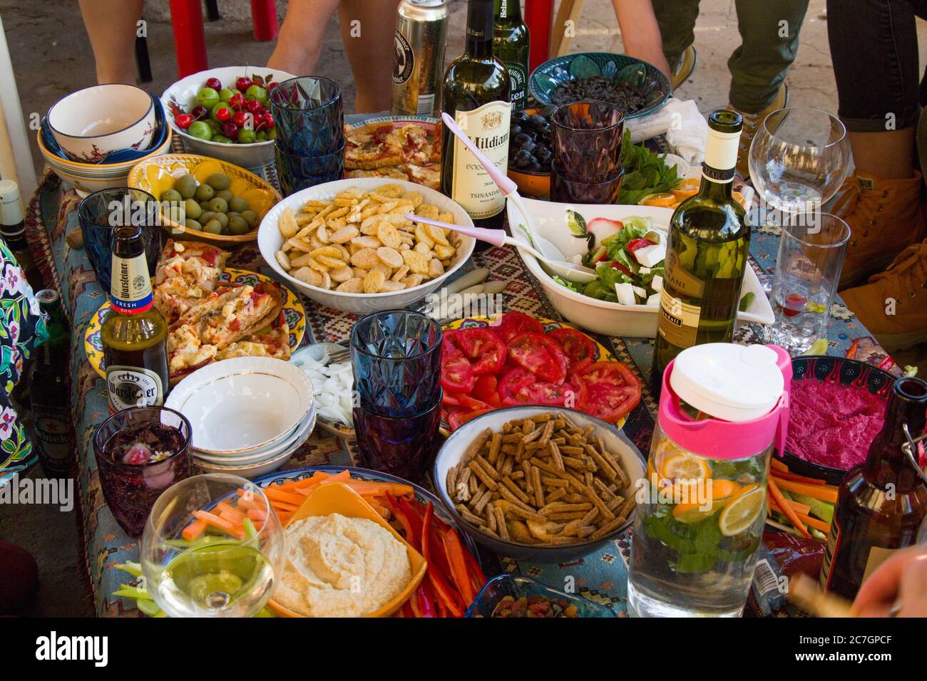 Full table view, people hands and eating process. Friends at the table ...