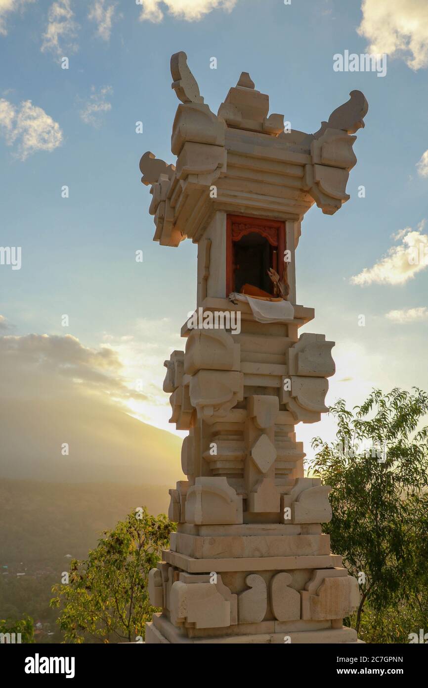 Hindu offering altar located in Bali in Indonesia. Dramatic sunset ...