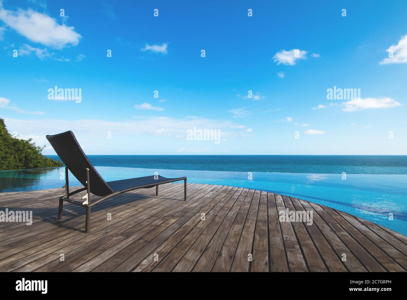 Infinity pool with views of the sea and blue sky Stock Photo - Alamy