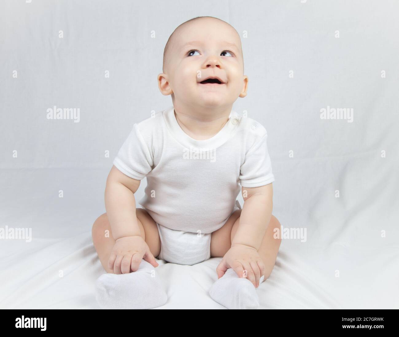 Image of a sitting eight month old baby Stock Photo - Alamy