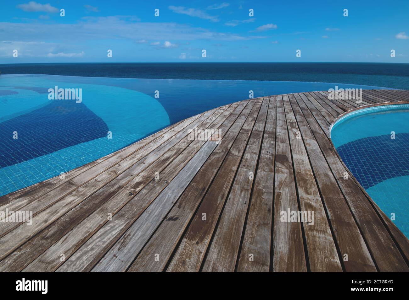 Infinity pool with views of the sea and blue sky Stock Photo - Alamy
