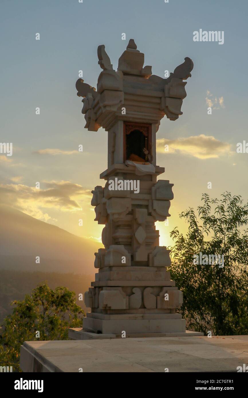 Hindu offering altar located in Bali in Indonesia. Dramatic sunset ...