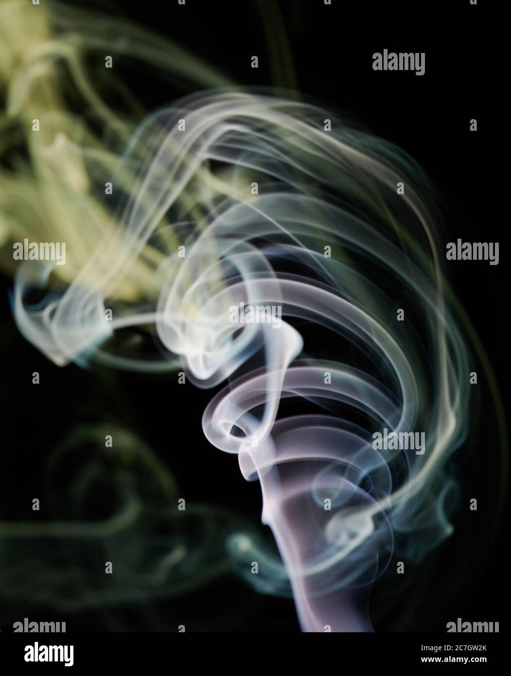 Transparent colorful smoke swirl with smooth shape in black backdground ...