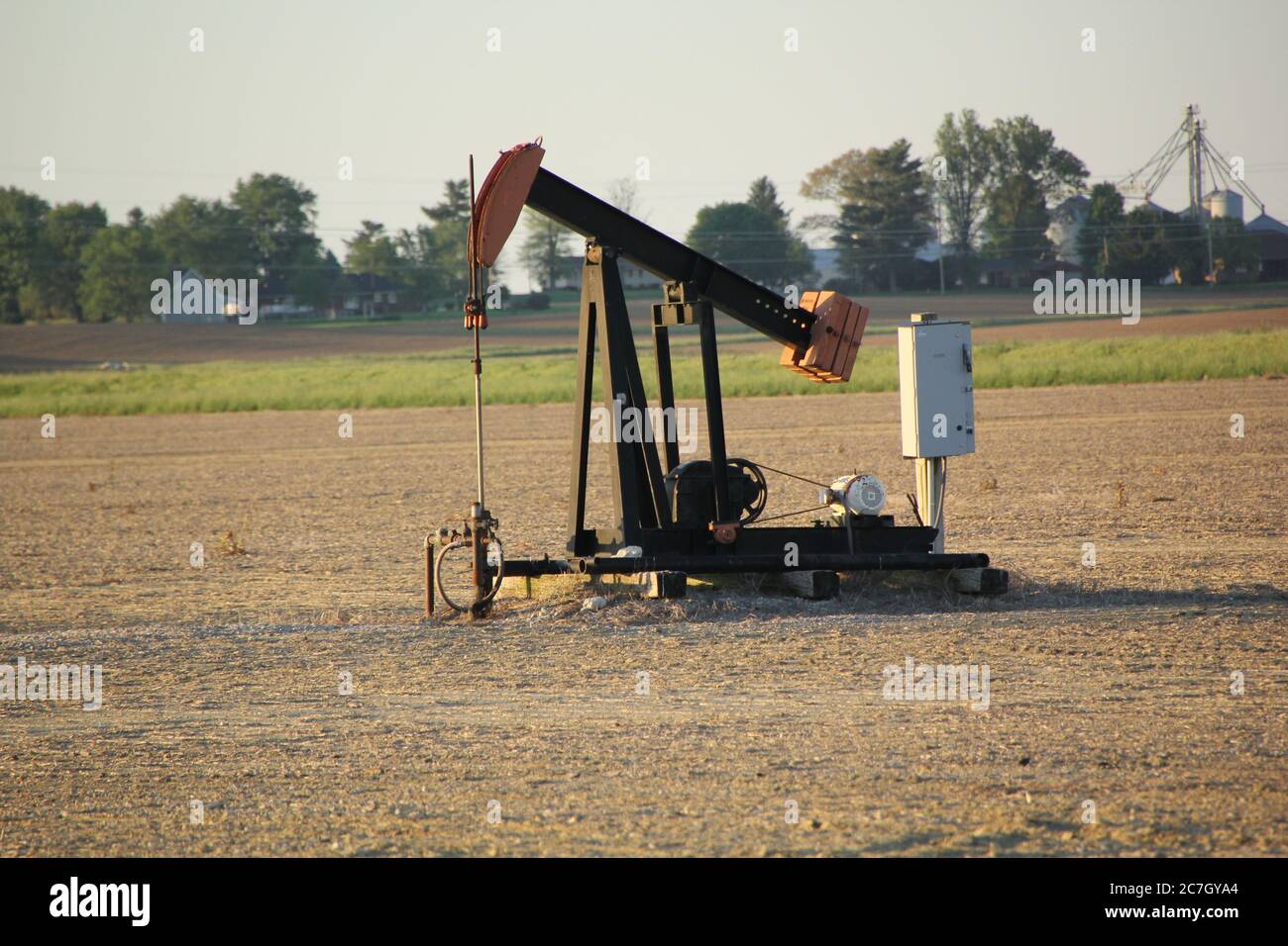 Oil drilling pump on field USA Stock Photo - Alamy