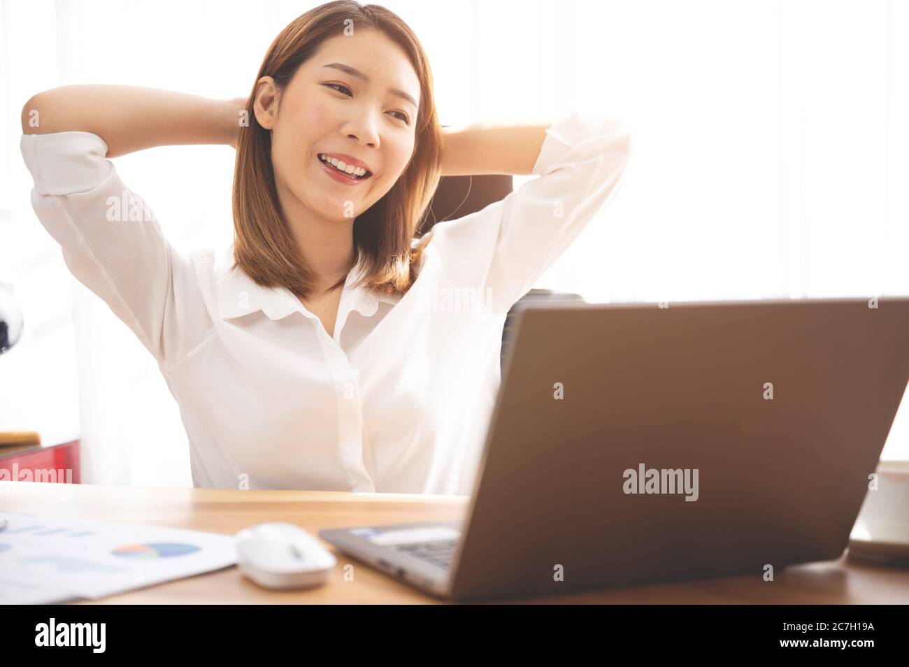 Young asian chinese ethnicity using laptop browsing,working,meeting or ...