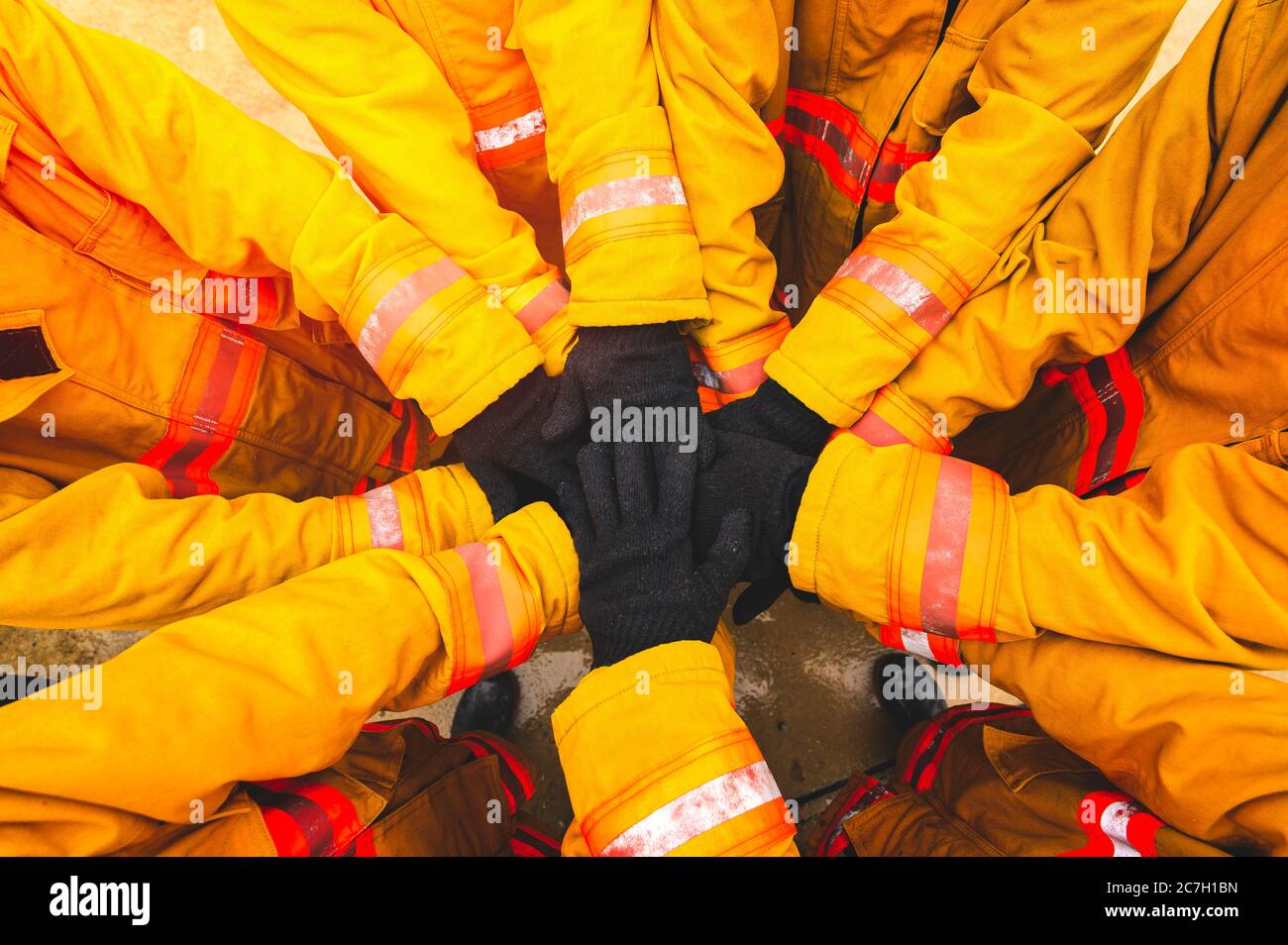 Firefighter putting hands up for fire fighting, Cheerful people giving ...