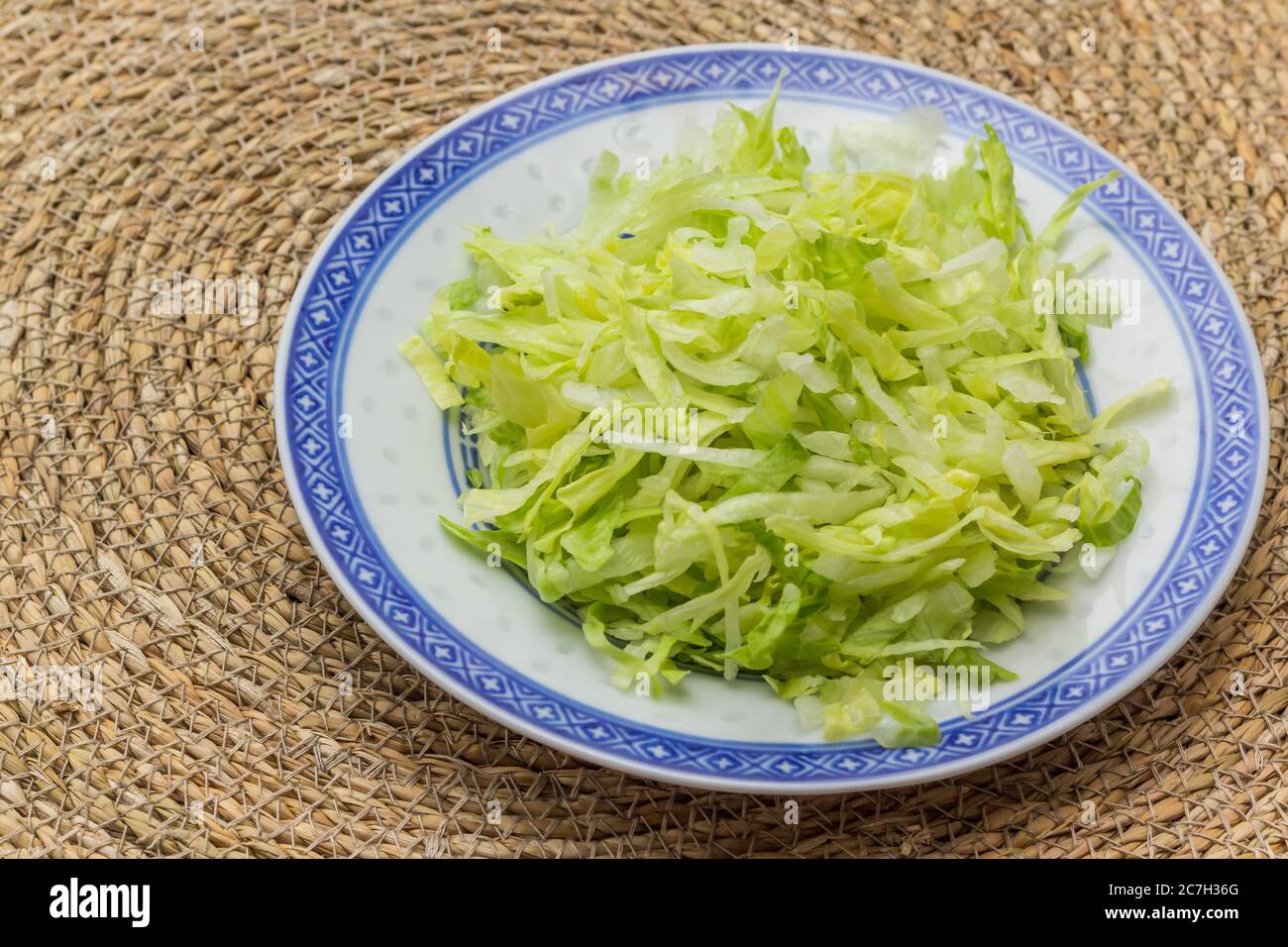 Chopped iceberg lettuce served on a chinese plate Stock Photo - Alamy