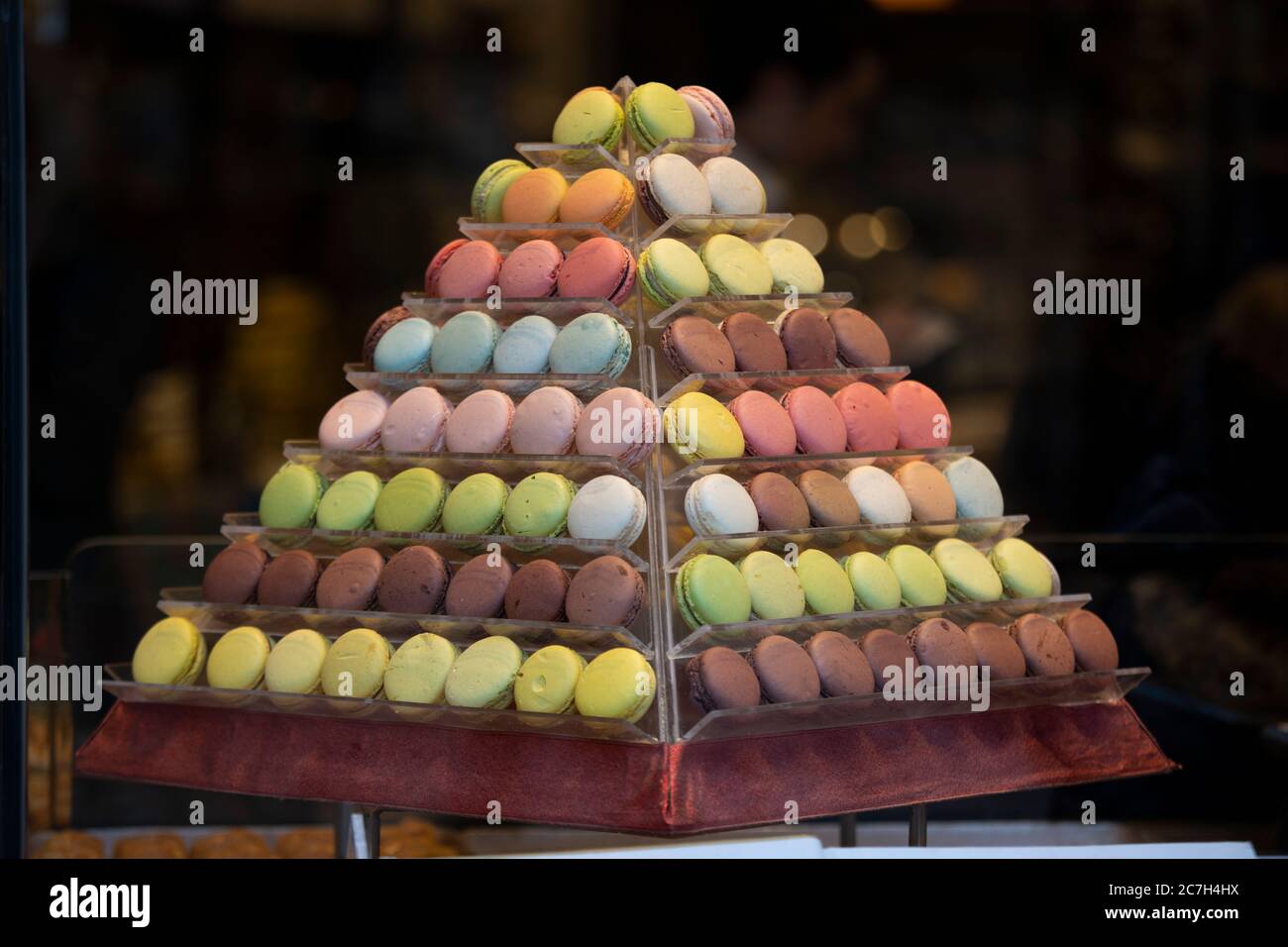 Macarons lined up on the pyramid bench. Close-up Stock Photo - Alamy