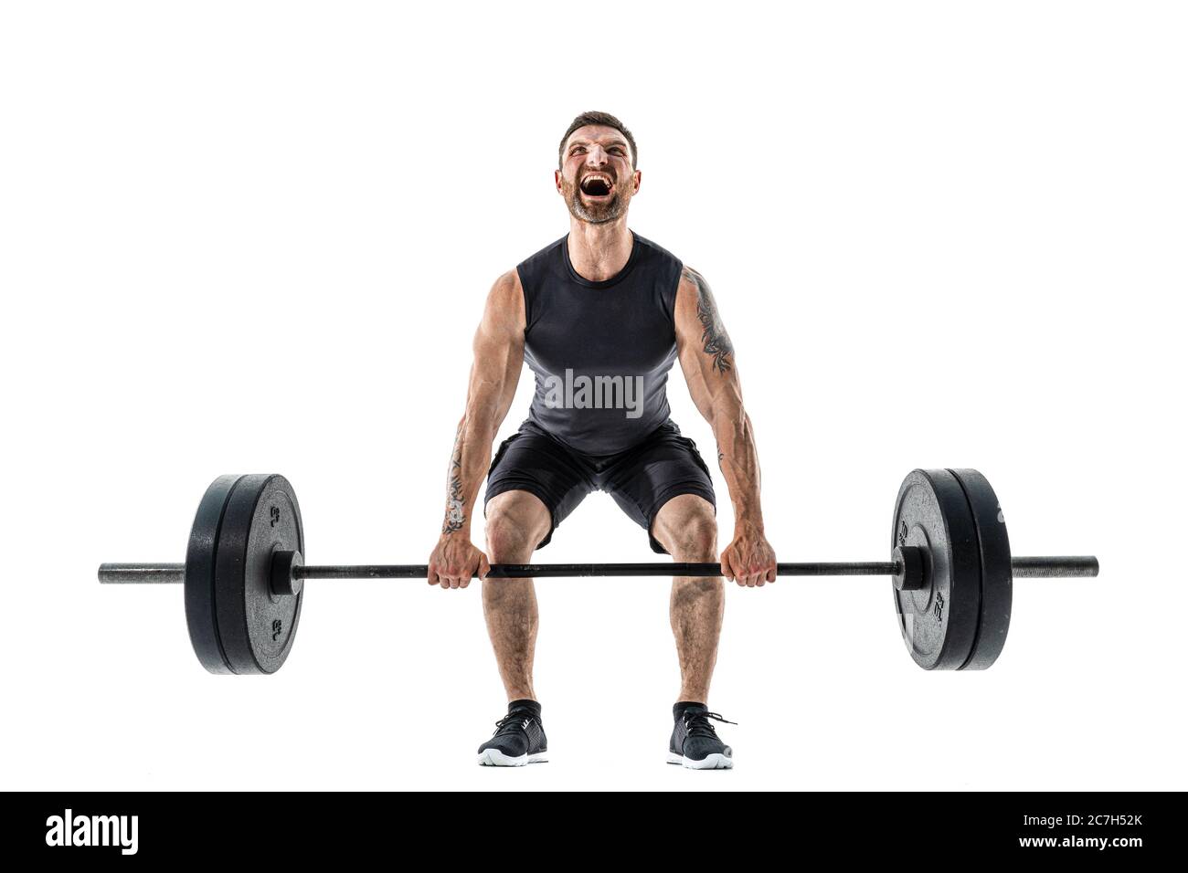 Fit Man Doing A Deadlift Exercise. Full length studio shot isolated on ...