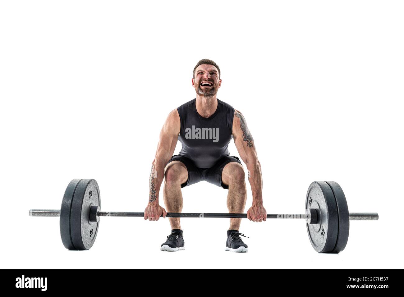 Fit Man Doing A Deadlift Exercise. Full length studio shot isolated on ...