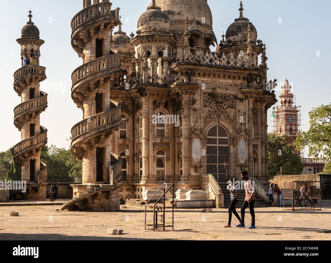 Junagadh, Gujarat, India - December 2018: A young couple walks past the ...