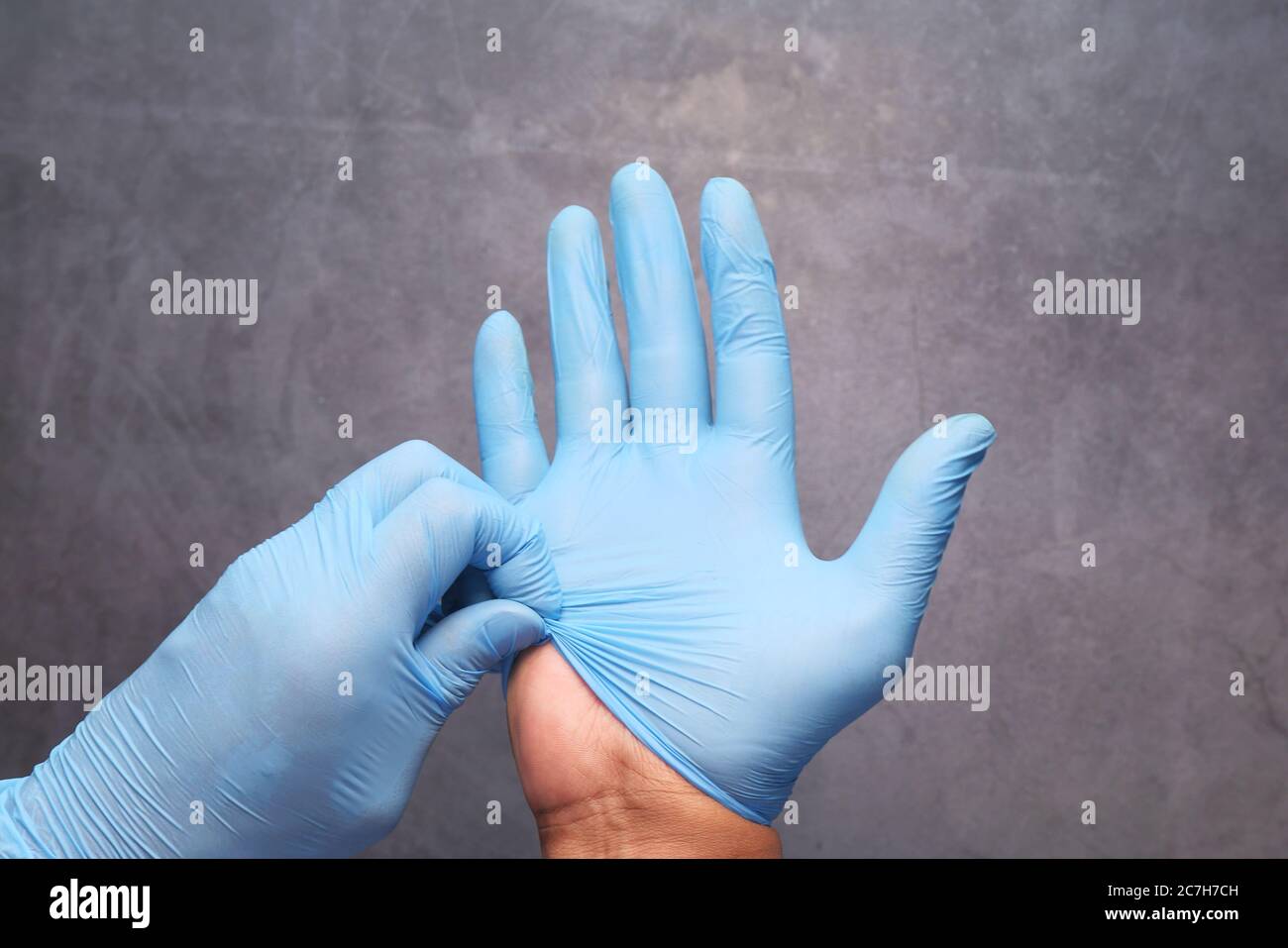Doctor wears medical latex gloves hi-res stock photography and images ...