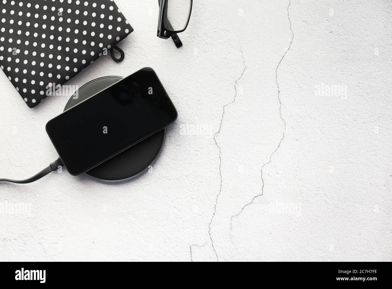 charging Smartphone Using Wireless Charging Pad, top view Stock Photo ...