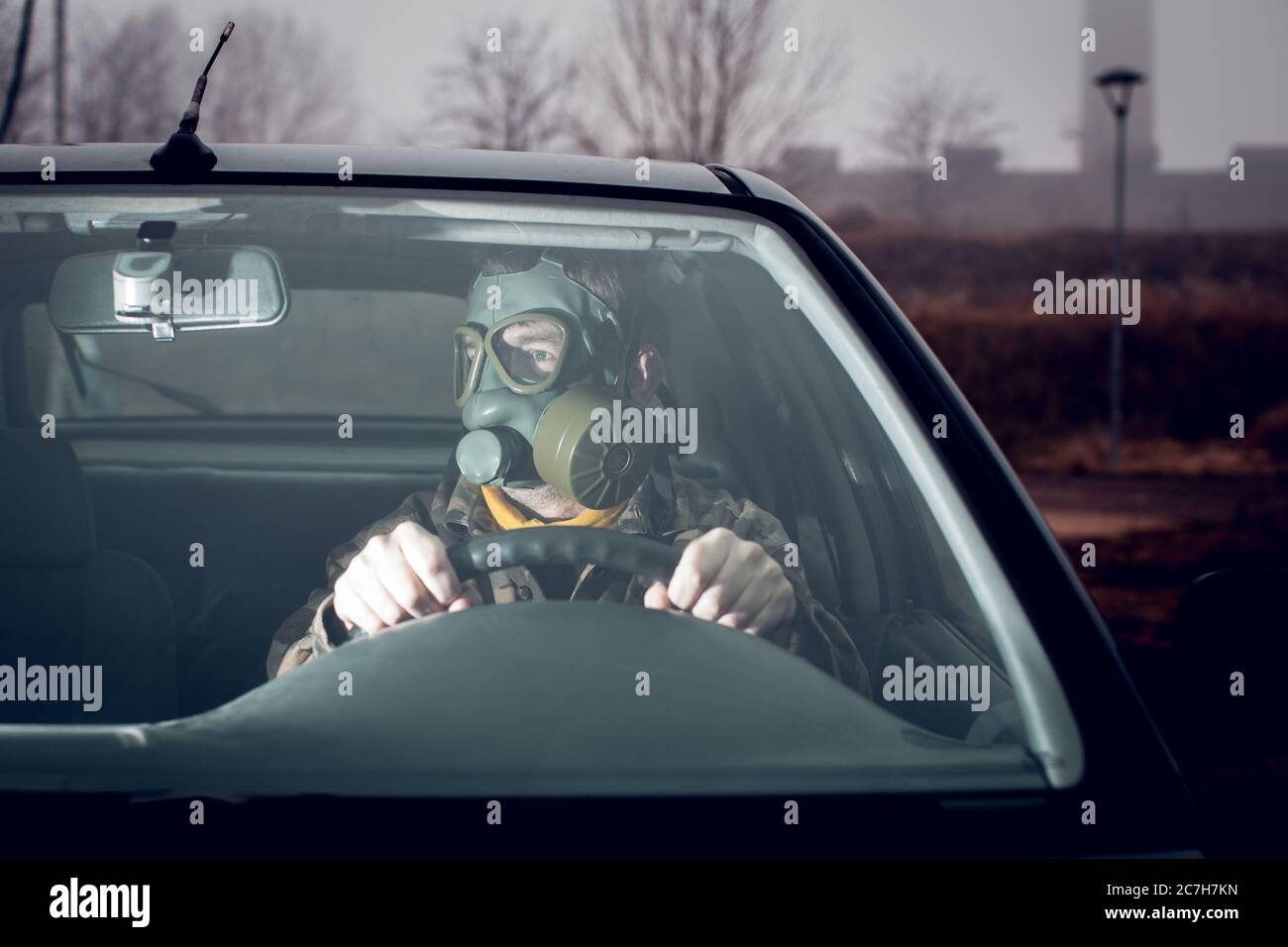 driving a car wearing gas mask Stock Photo - Alamy