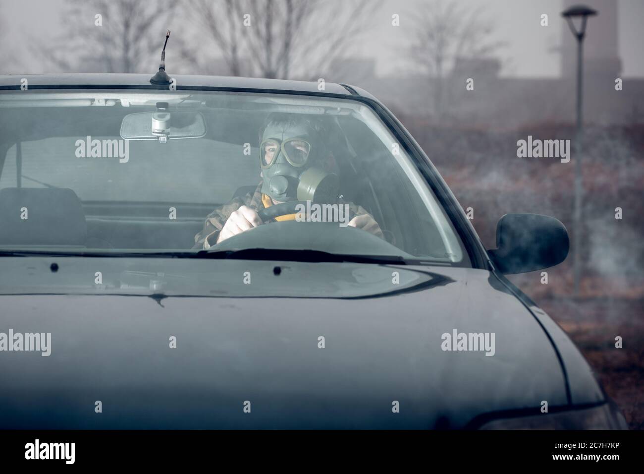 driving a car wearing gas mask Stock Photo - Alamy