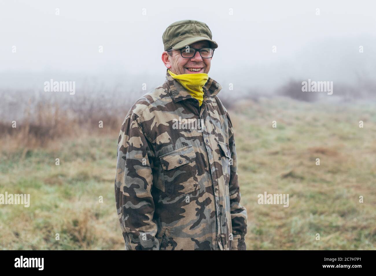 portrait of a senior soldier standing at the field and smiling Stock ...