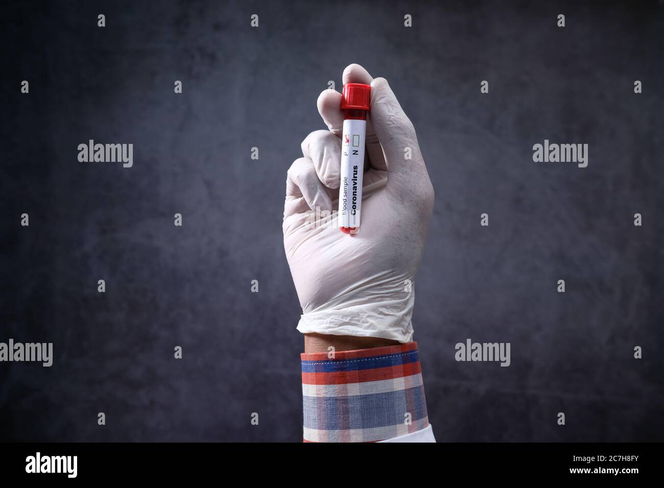 laboratory technician hand holding blood test tube Stock Photo - Alamy