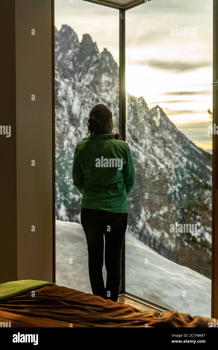 Woman climbing out window hi-res stock photography and images - Alamy