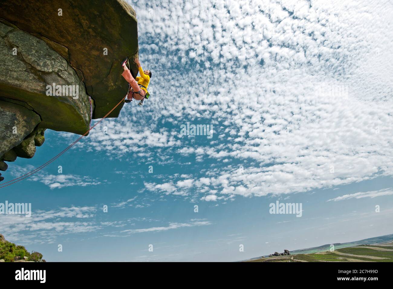 woman climbing at Windgather rocks in the British Peak District Stock ...