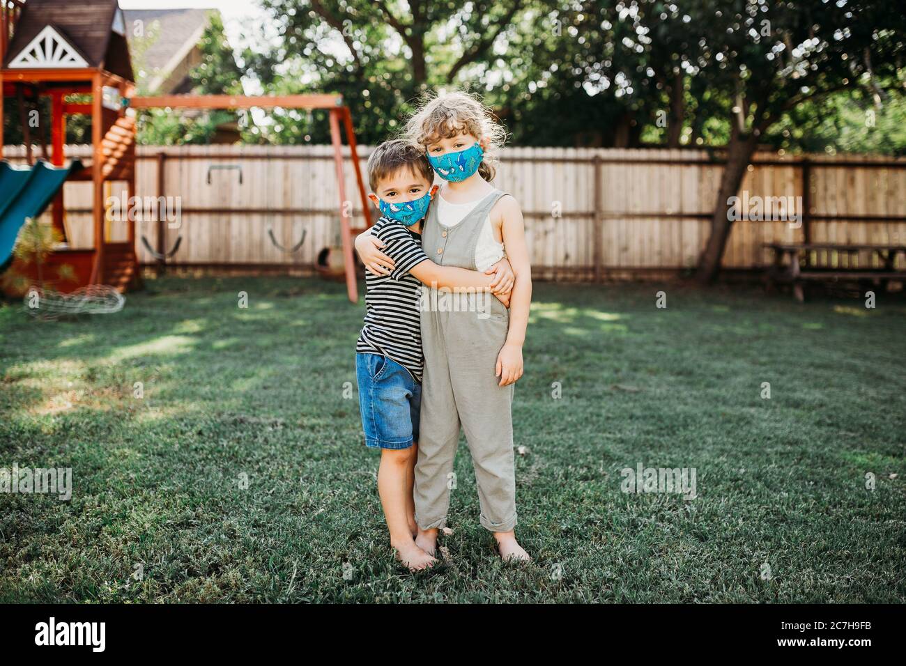 Two kids hugging kindergarten hi-res stock photography and images - Alamy