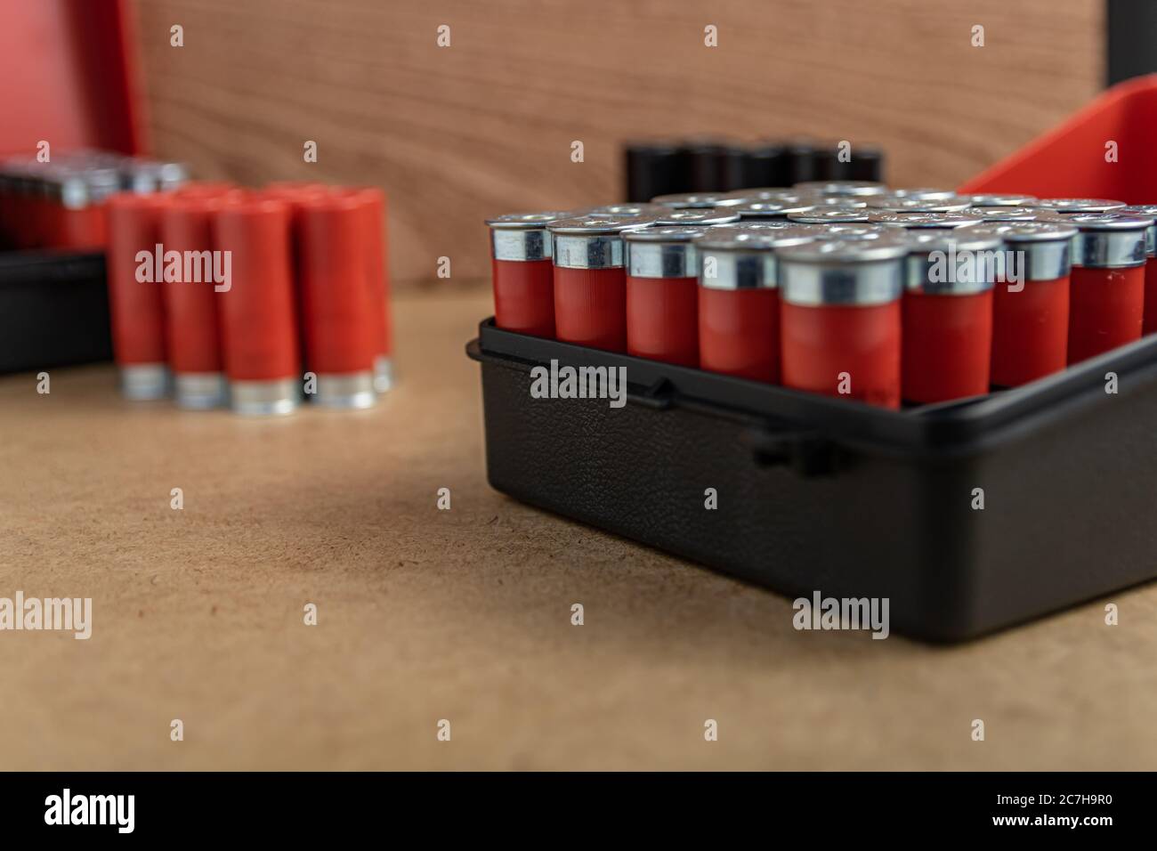 Closeup shot of a full shotgun ammo box on a brown surface Stock Photo ...