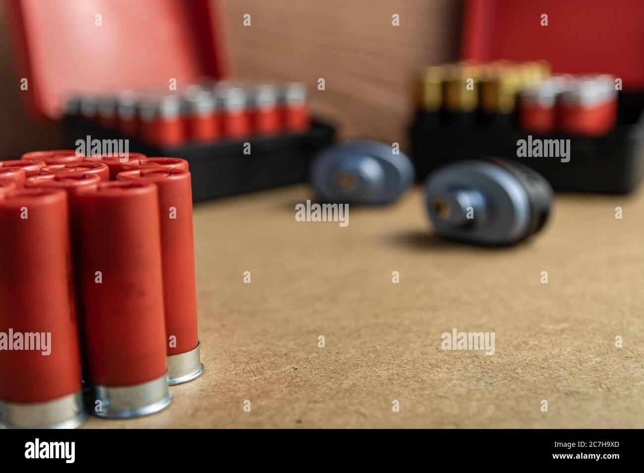 Closeup shot of red shotgun shells on a brown surface Stock Photo - Alamy
