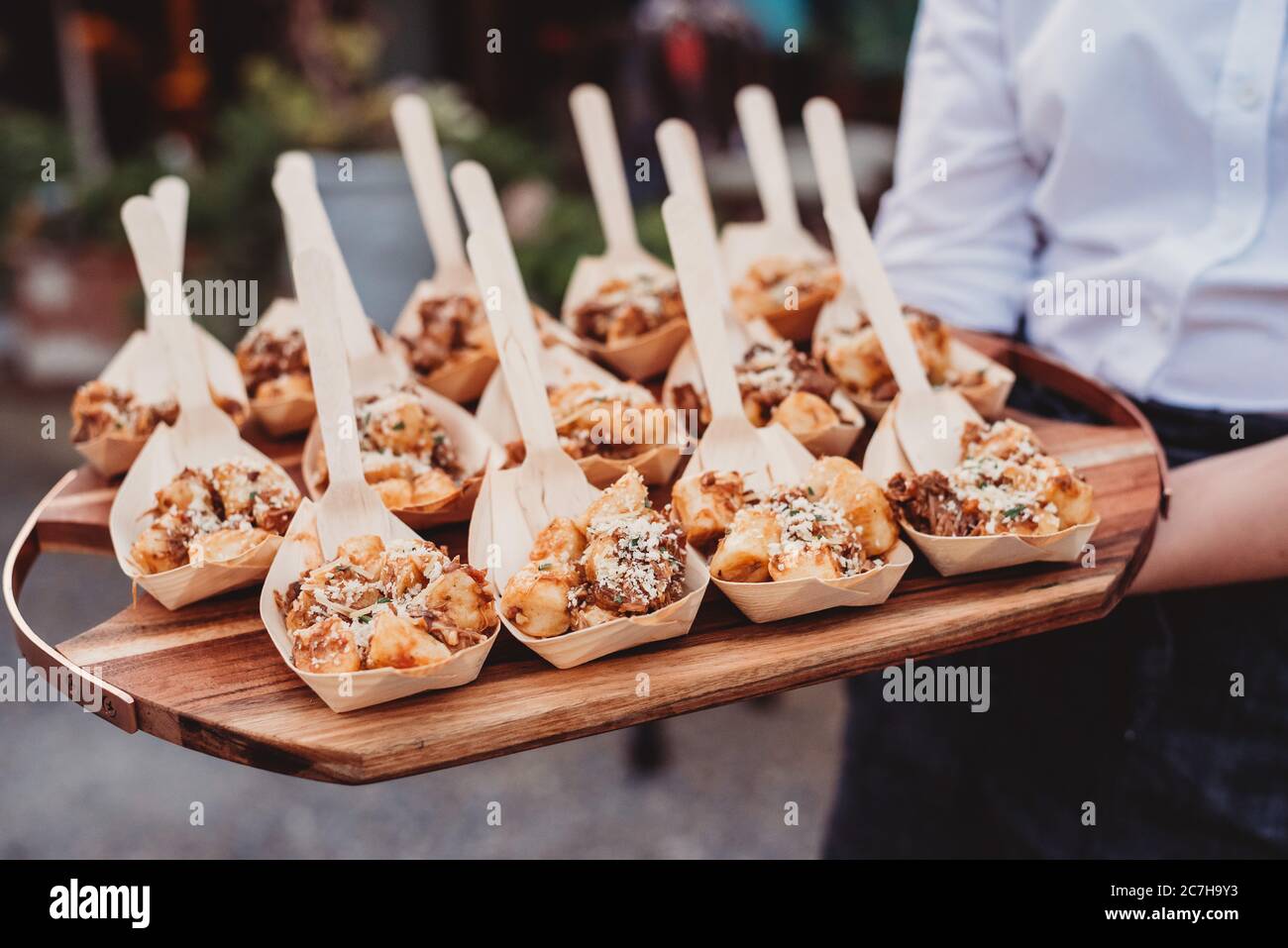 Waitress with canapés hi-res stock photography and images - Alamy