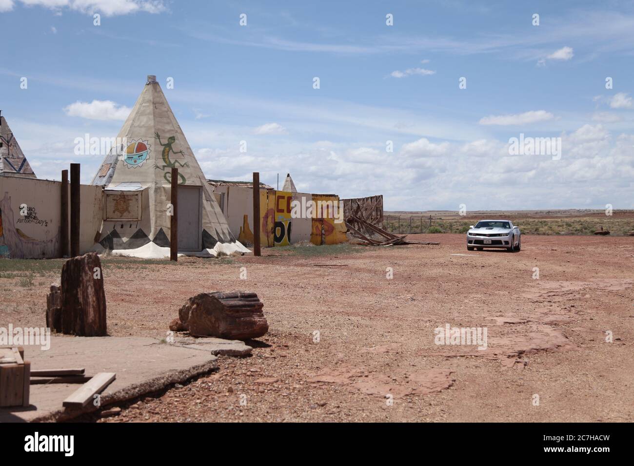 A Chevy Camaro parks in the desert land of Meteor City Trading Post ...